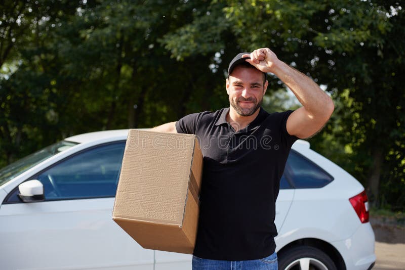 Smiling delivery man stock image. Image of mail, male - 45052839
