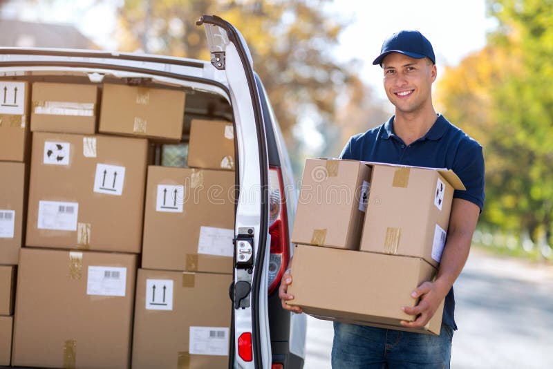 Smiling Delivery Man Loading Boxes into His Truck Stock Image - Image ...