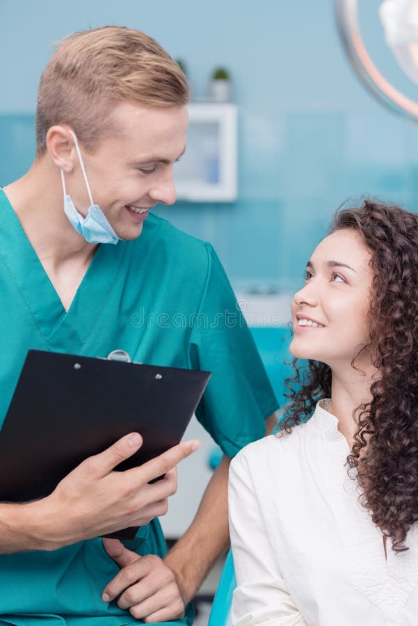 Smiling Dentist with the Patient Stock Photo - Image of healthcare ...