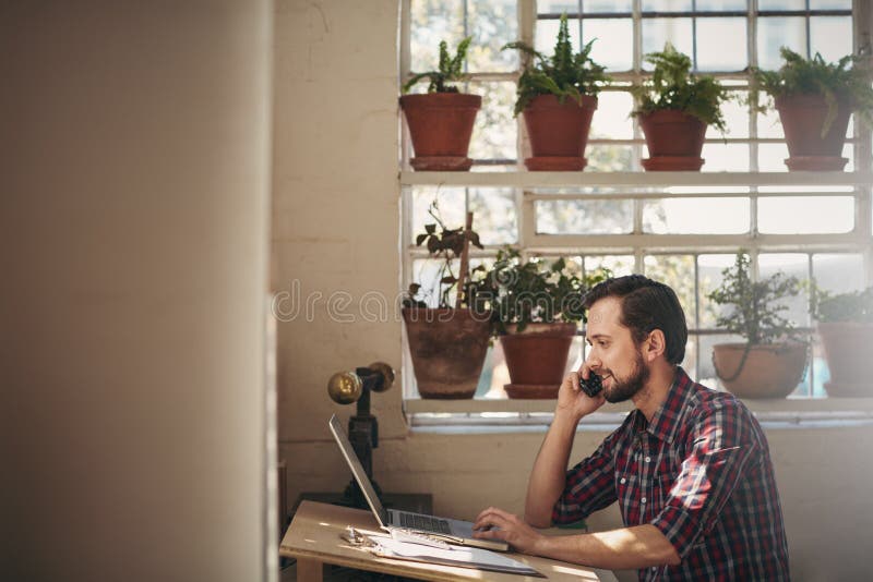 Smiling Designer Talking on Phone at His Studio Desk Stock Photo ...