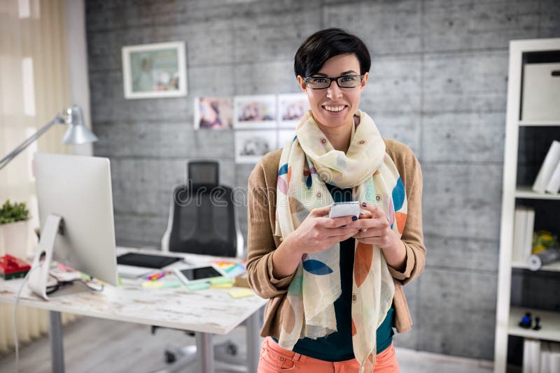 Smiling Designer Texting on Smart Phone Stock Photo - Image of office ...