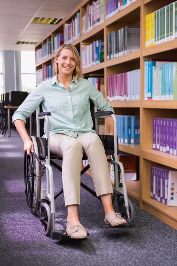 Smiling Disabled Student with Classmate in Library Stock Photo - Image ...