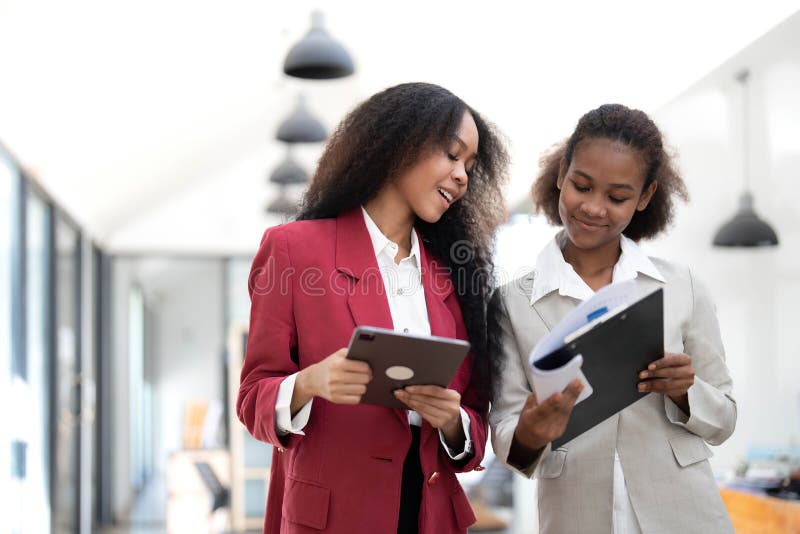 Smiling Diverse Colleagues Businesswomen Working On Laptop Together