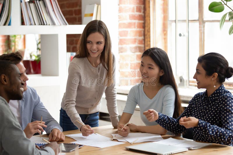 Smiling Diverse Students Worn on Project in Classroom Together Stock ...