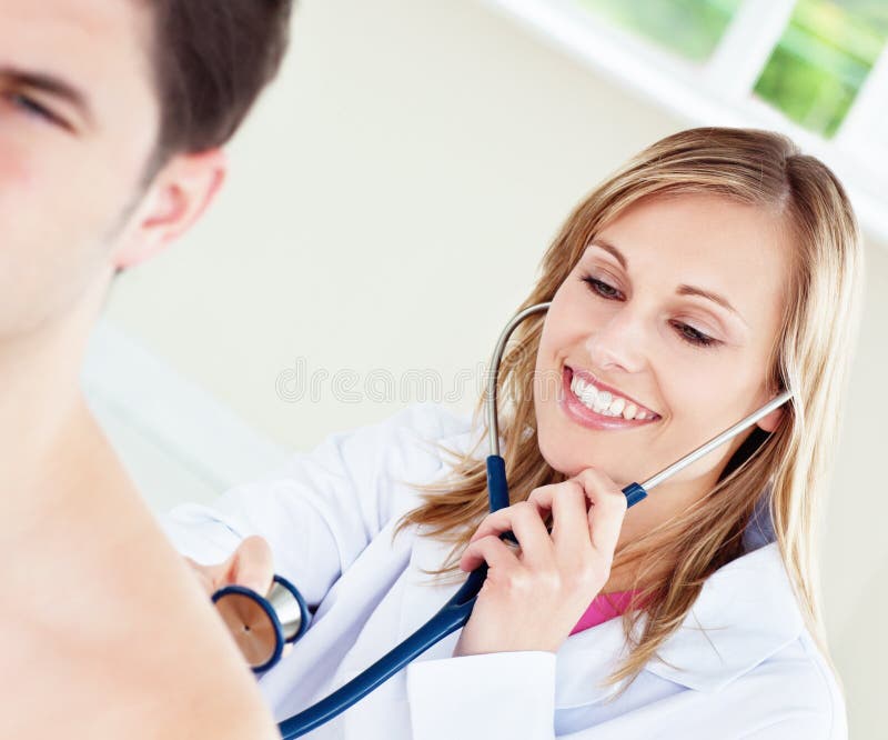 Smiling Doctor is Examining Her Patient Stock Image - Image of ...