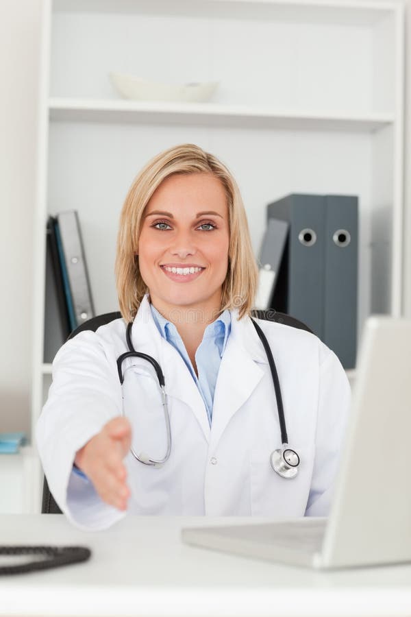 Smiling doctor giving hand stock image. Image of medic - 20478307