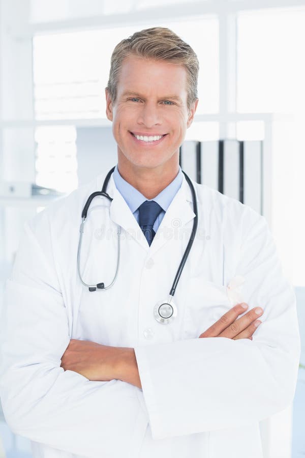 Smiling Doctor Looking at Camera with Arms Crossed Stock Photo - Image ...