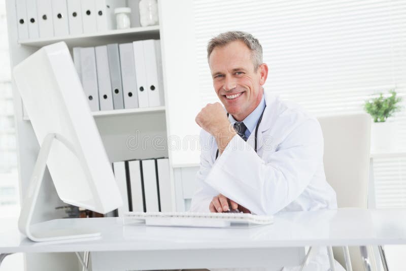 Smiling Doctor Looking at Camera Stock Image - Image of camera, side ...