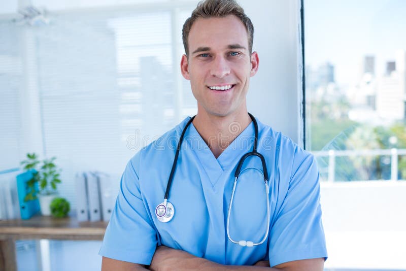 Smiling Doctor Looking at the Camera Stock Photo - Image of happy ...
