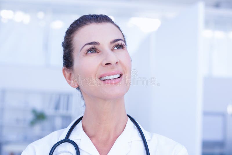 Smiling doctor looking up stock image. Image of female - 54765129