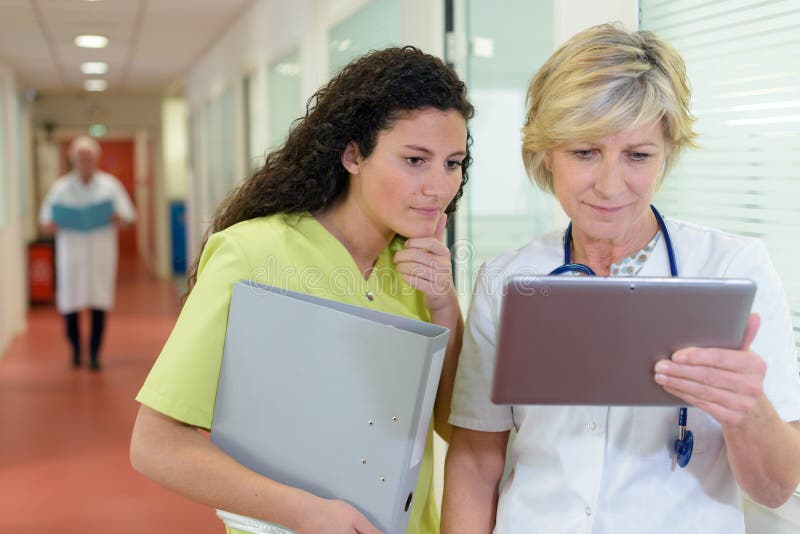Smiling Doctor and Nurse with Digital Tablet Stock Image - Image of ...