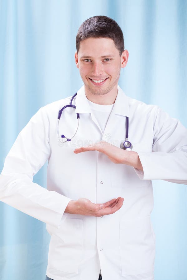 Smiling Doctor Presents Something Stock Image - Image of positive ...