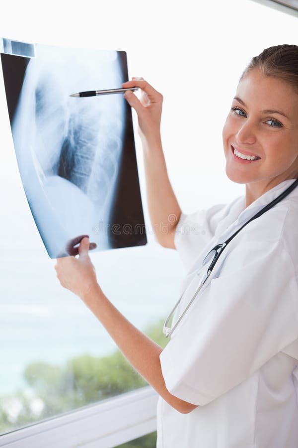 Smiling doctor with x-ray stock photo. Image of radiologist - 22362598