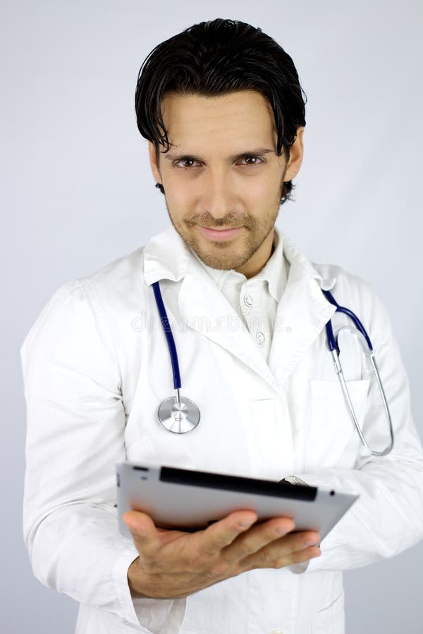 Smiling doctor with tablet stock image. Image of person - 35703421