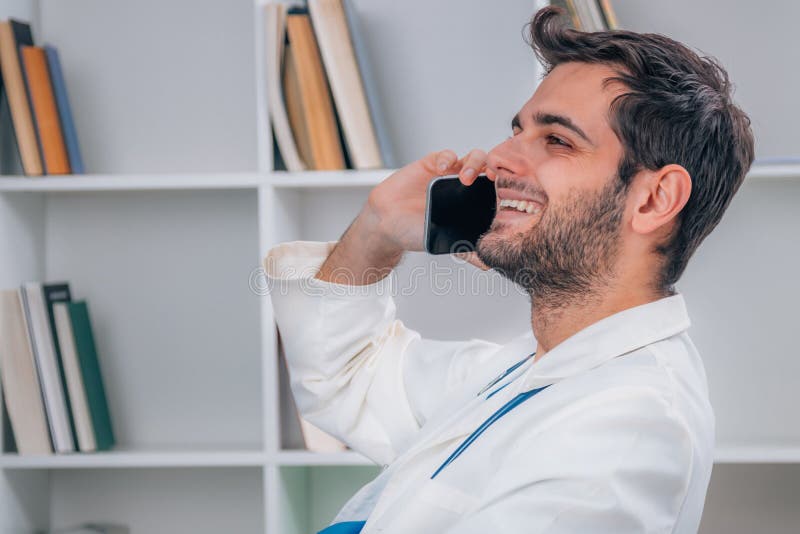Doctor Talking on Mobile Phone Stock Photo - Image of call, hospital ...