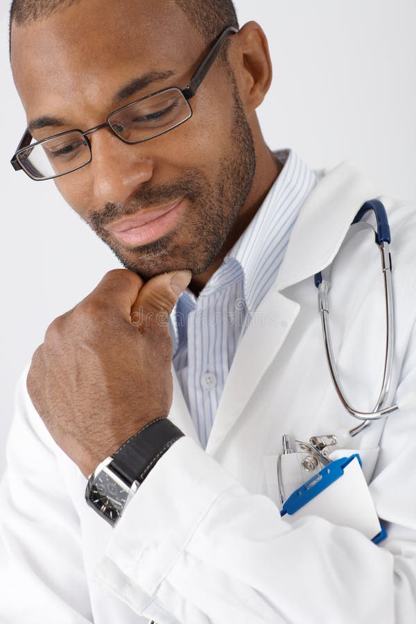 Smiling doctor thinking stock photo. Image of american - 23376158