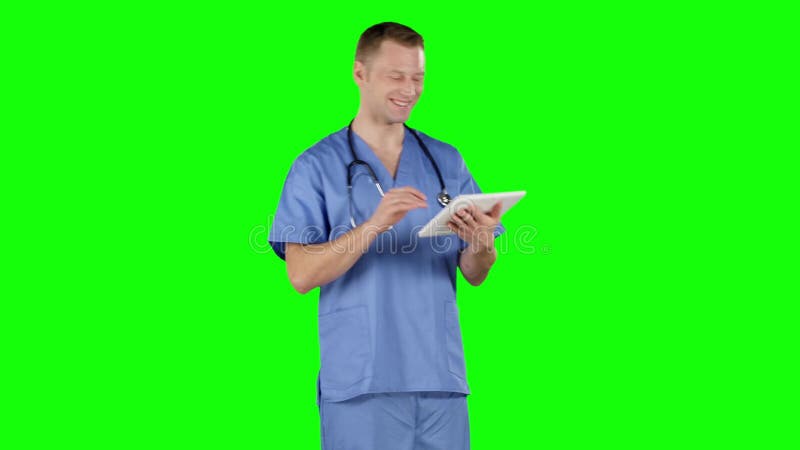 Smiling Doctor Using a Tablet. Green Screen Stock Footage - Video of ...