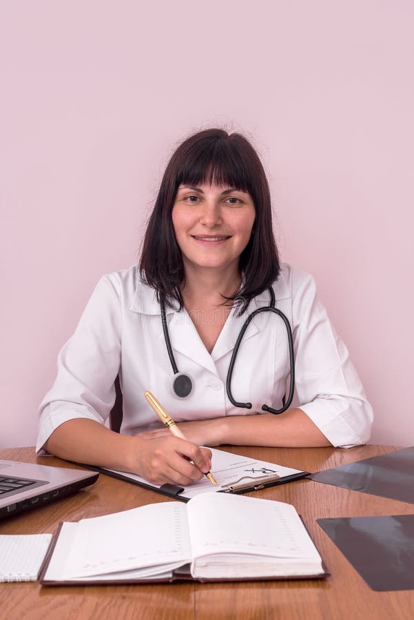 Smiling Doctor at Workplace with Patient`s X-rays Stock Photo - Image ...