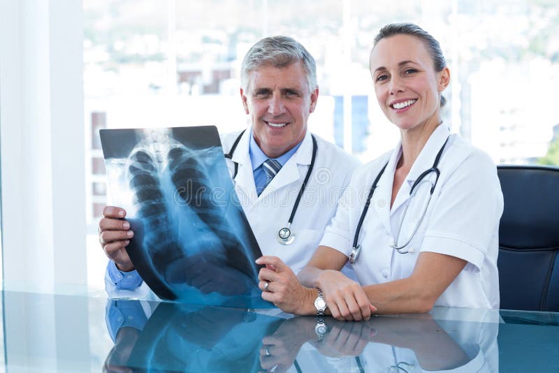 Smiling Doctors Looking at Camera and Holding Xray Stock Photo - Image ...