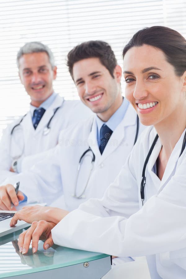 Smiling Doctors Looking at Camera Stock Image - Image of happy, clinic ...