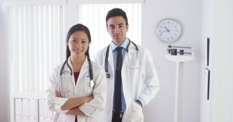 Smiling Doctors Standing in Office Stock Footage - Video of successful ...