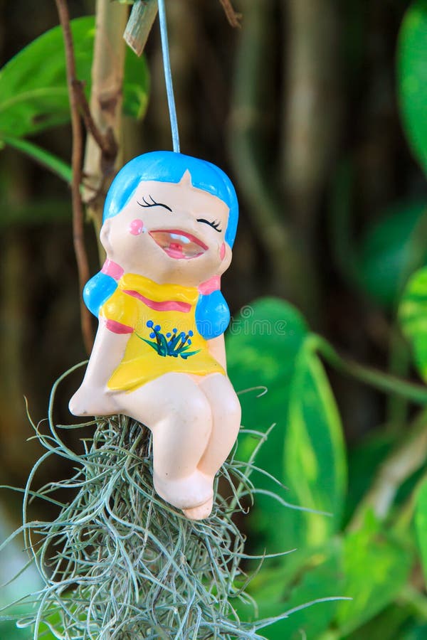 Smiling doll stock image. Image of tree, yellow, cradle - 47187805
