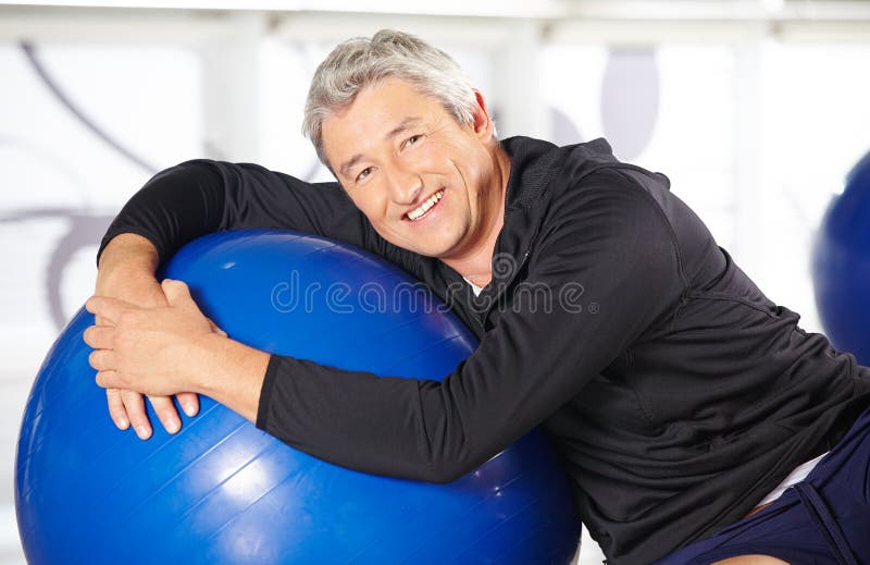 Smiling Elderly Man with Exercise Stock Photo - Image of physiotherapy ...