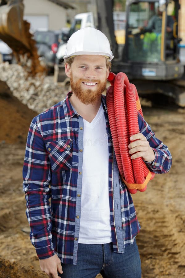 Smiling Electrician with Wire Roll on Shoulder Stock Photo - Image of ...