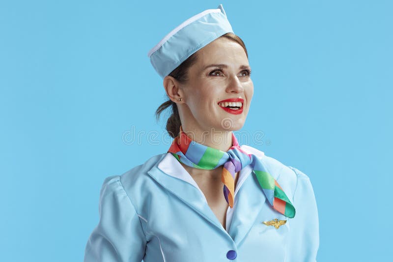 Elegant Female Air Hostess on Blue Background in Blue Uniform Looking ...