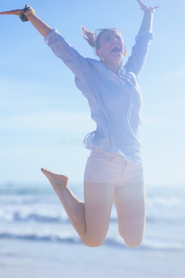 Smiling Elegant Woman at Beach Jumping Stock Image - Image of oasis ... Smiling Elegant Woman at Beach Jumping Stock Image - Image of oasis ...