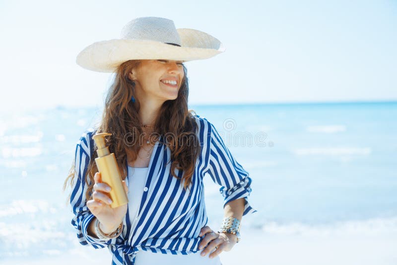 Smiling Elegant Woman on Beach with Sunscreen Stock Photo - Image of ... Smiling Elegant Woman on Beach with Sunscreen Stock Photo - Image of ...