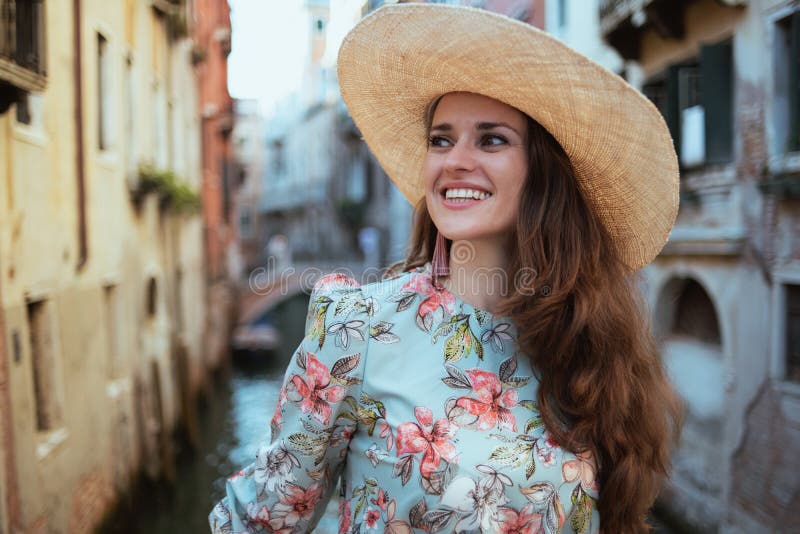 Smiling Elegant Woman in Floral Dress Having Walking Tour Stock Photo ... Smiling Elegant Woman in Floral Dress Having Walking Tour Stock Photo ...