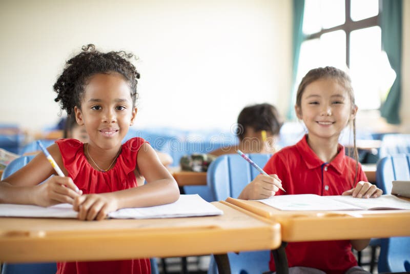 Elementary School Kids in Classroom Stock Photo - Image of education ...