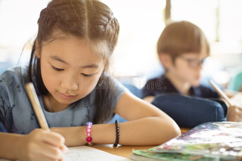 Elementary School Kids in Classroom Stock Photo - Image of classmate ...