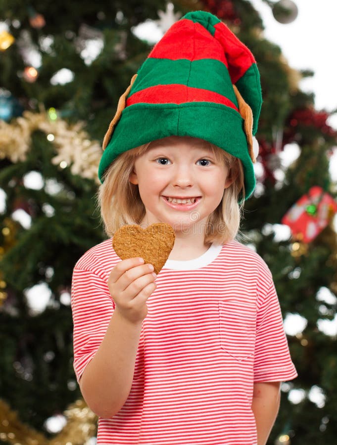 Smiling Elf Boy Holding Gingerbread Cookie Stock Image - Image of ...