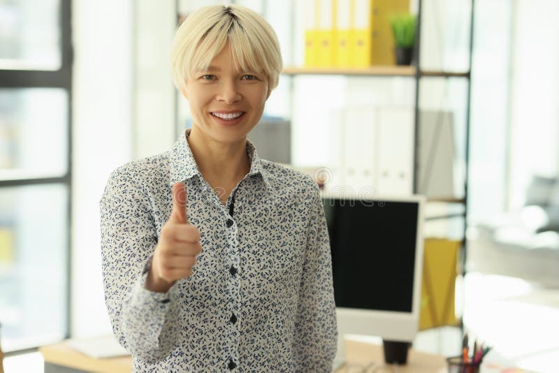 Smiling Employee Showing Approval Sign Standing in Office Stock Image ...