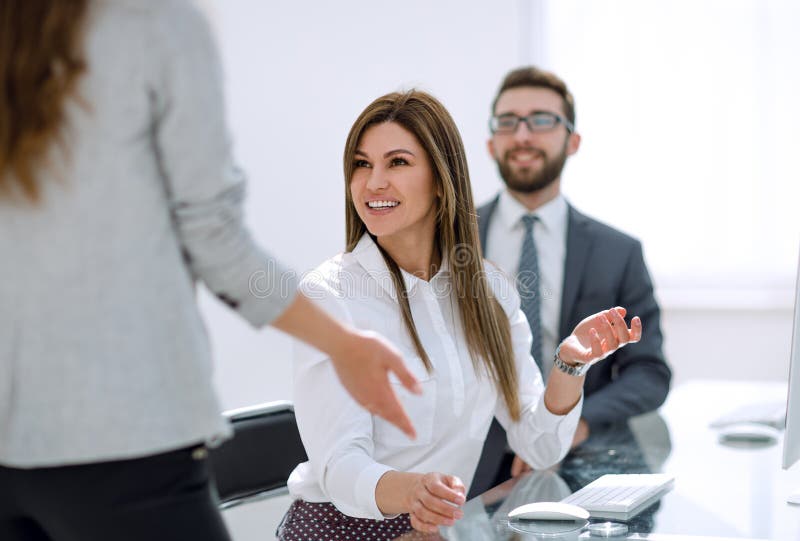 Smiling Employees Talking in the Workplace. Stock Image - Image of ...