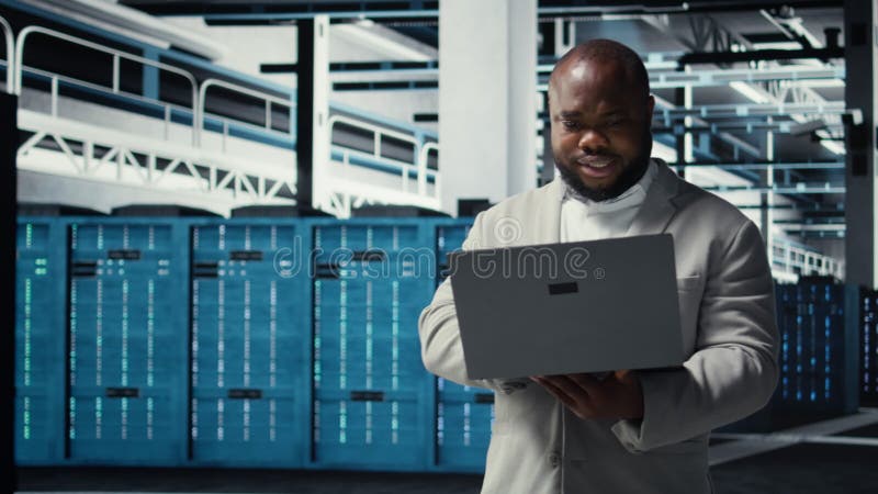 Smiling Engineer in Data Center Managing Software Using Laptop Stock Video - Video of monitoring ...