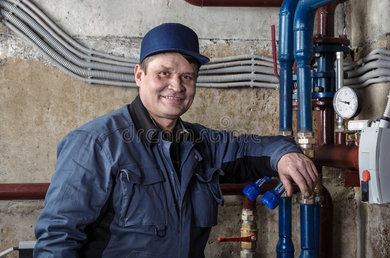 Smiling engineer plumber. stock image. Image of heating - 61122661