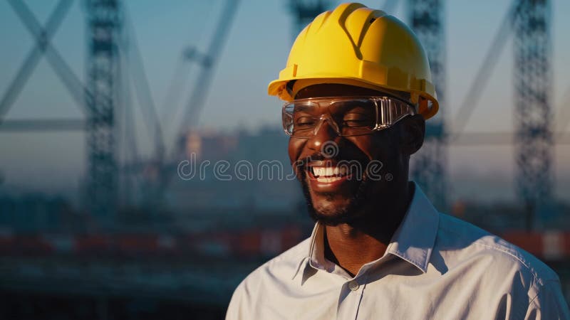 Smiling Engineer Relishing Sunset on Construction Site with Crane ...
