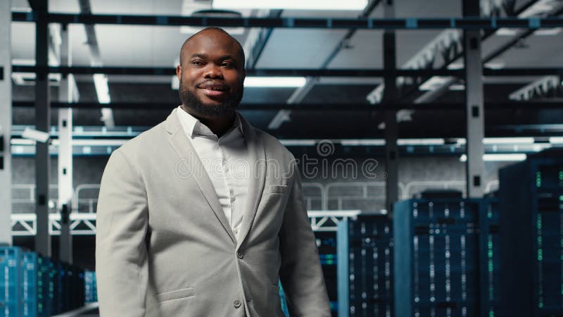 Smiling Engineer Walking in Data Center, Checking Hardware for System ...