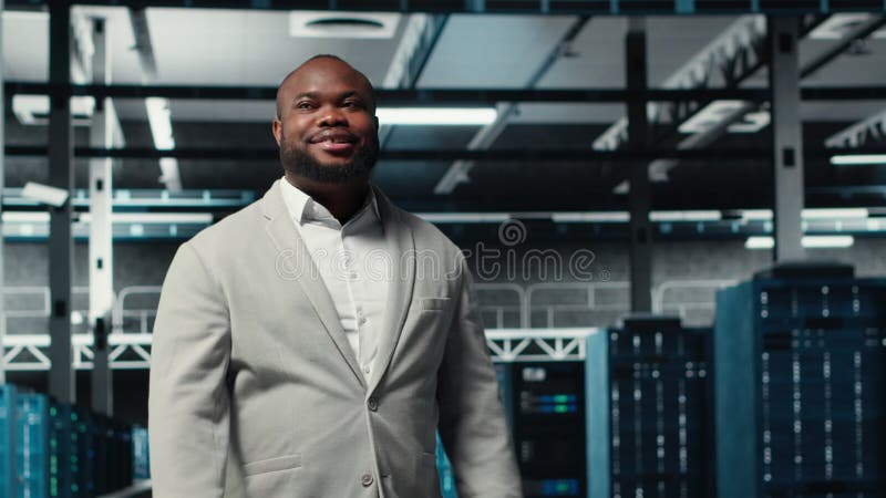 Smiling Engineer Walking in Data Center, Checking Hardware for System ...