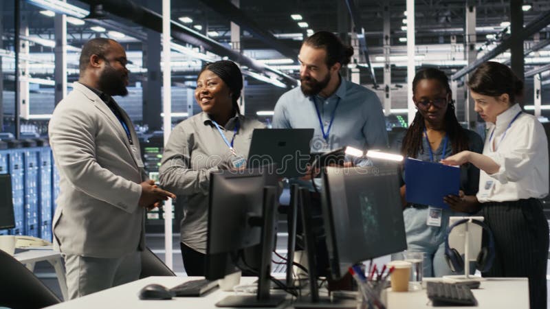 Smiling Engineering Team in Server Room Reviewing Infrastructure ...