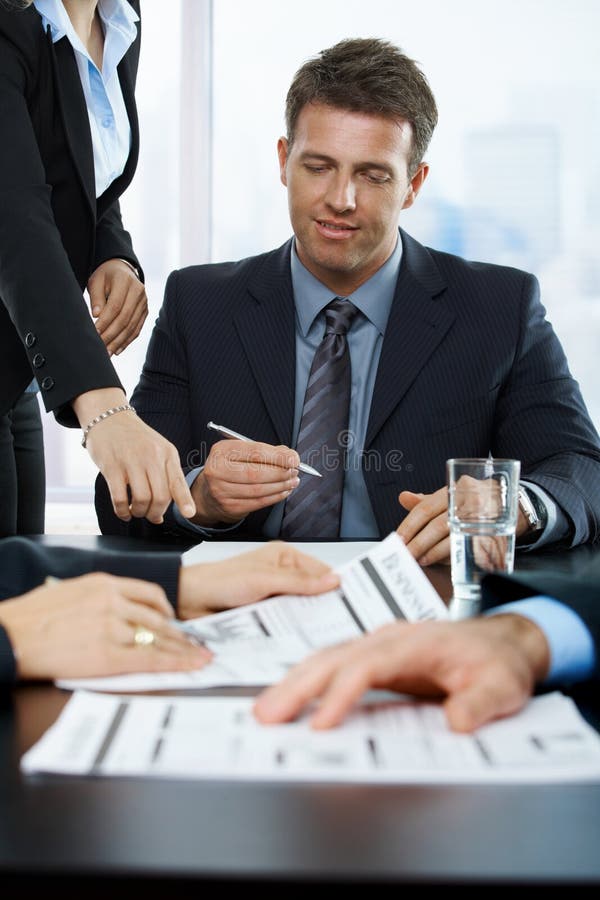 Smiling Executive Signing Contract Stock Image - Image of blond, adult ...