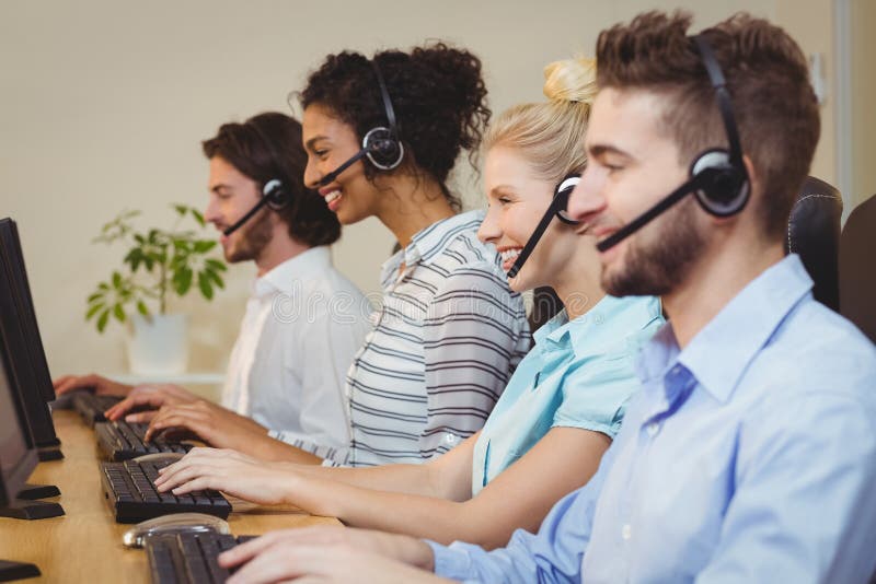 Smiling Executives Working in Call Center Stock Photo - Image of ...