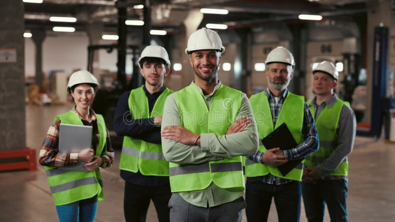 Smiling Mature Male Drive Worker in Safety Vest and Hard Hat Looking at ...