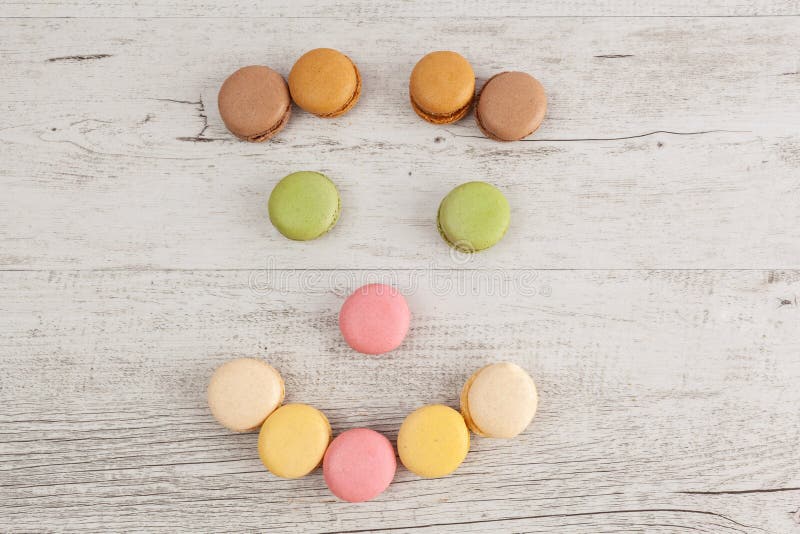 Smiling Face with Eyebrows Made from Macarons Stock Photo - Image of ...
