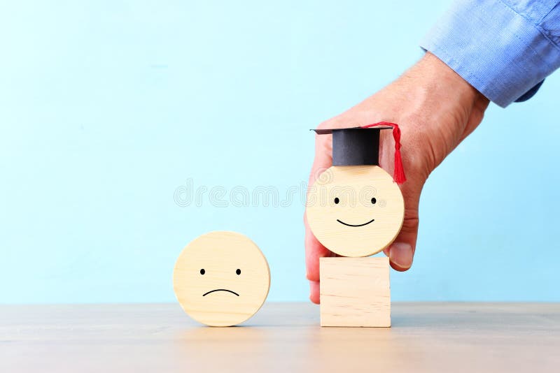 A Smiling Face with a Graduation Cap, in Front of a Sad Face. Concept ...