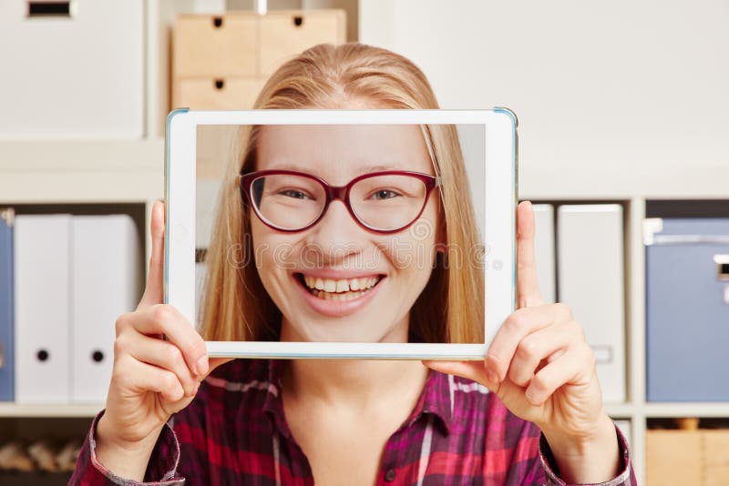 Smiling face on a tablet stock photo. Image of businesswoman - 89338382