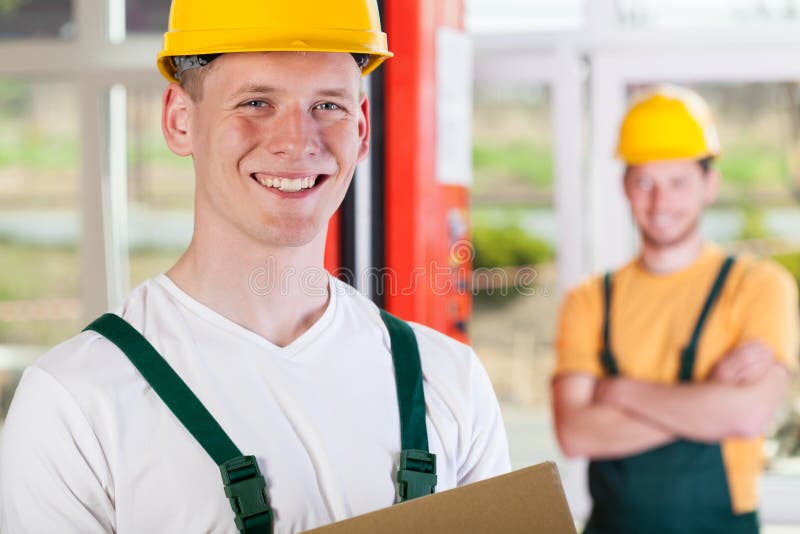 Smiling factory worker stock image. Image of boxes, plans - 39101089